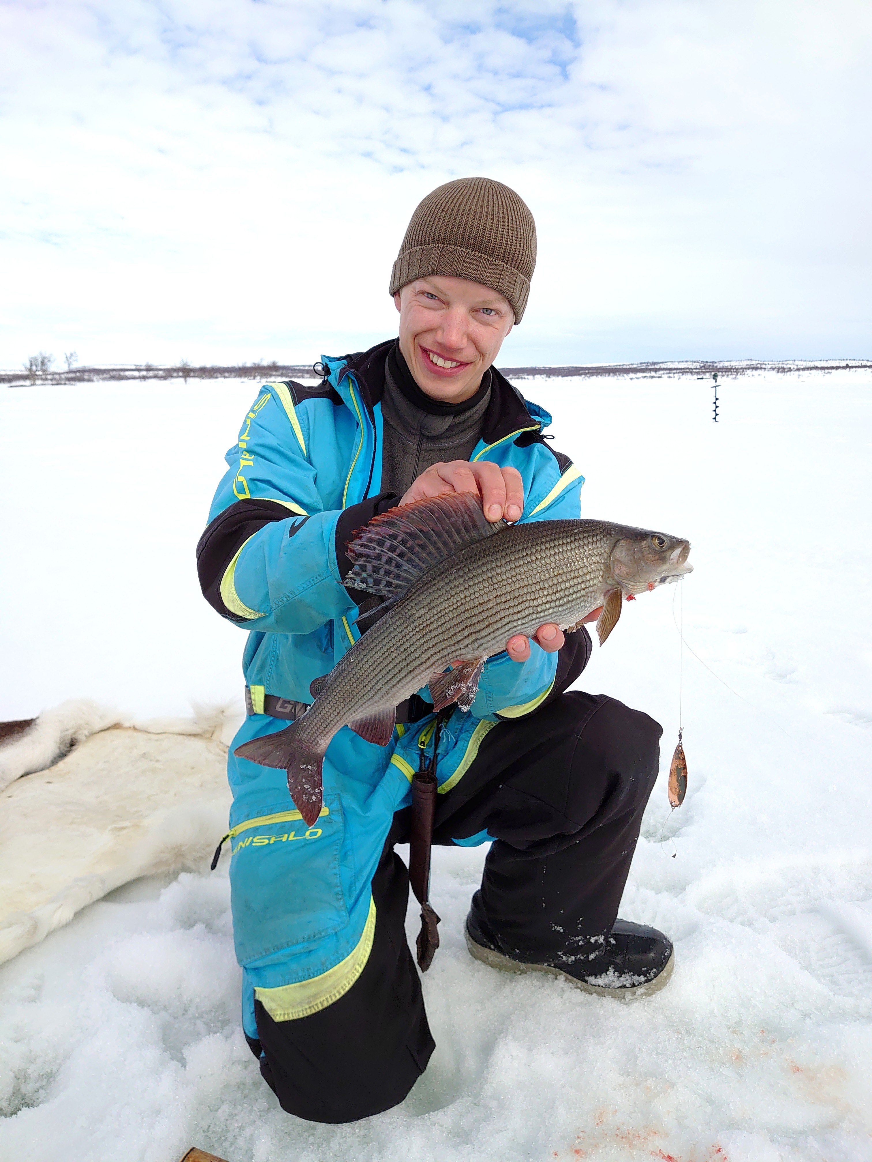 Ice fishing in Inari - Galddoaivi Safaris